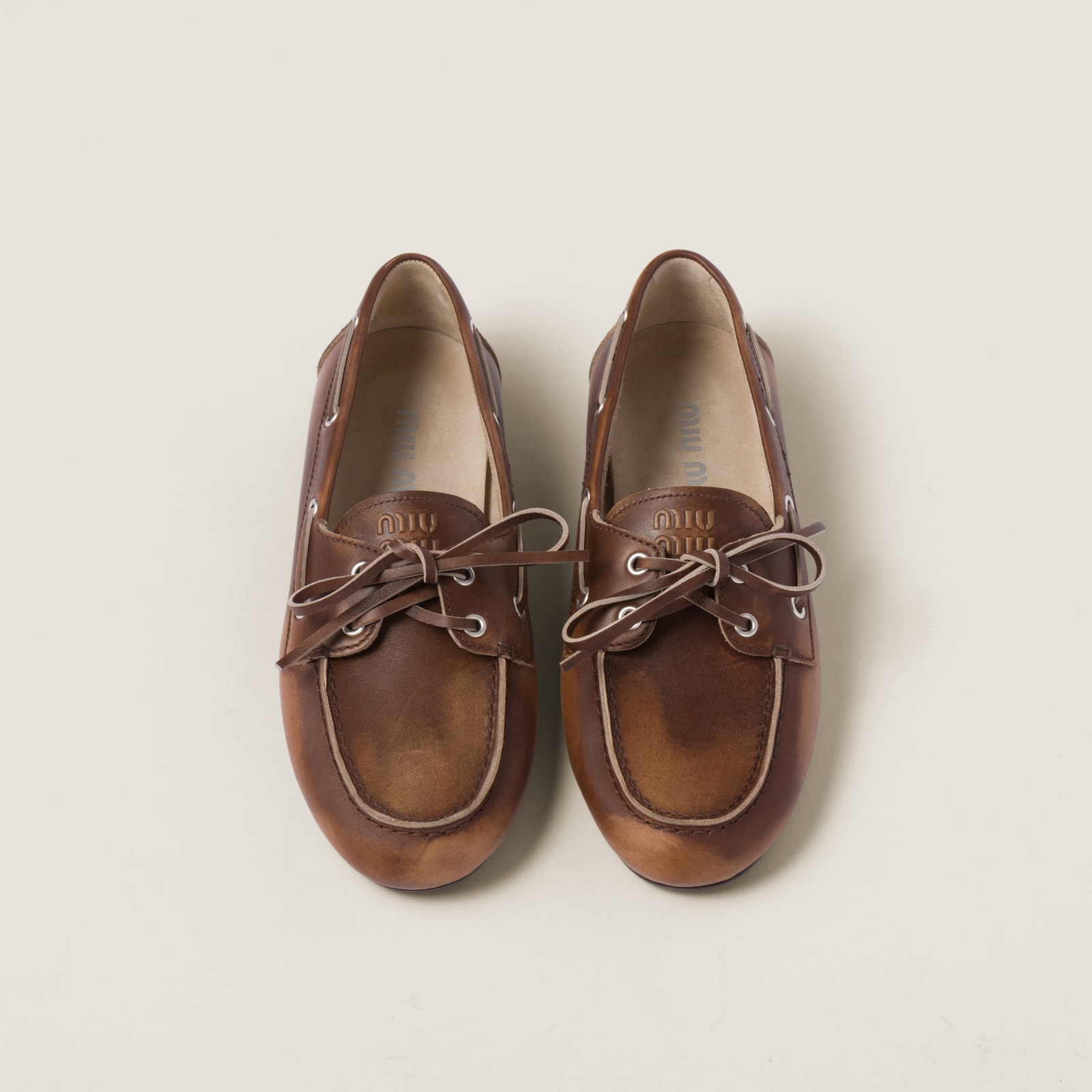 Sienna Unlined Bleached Leather Boat Shoes | Miu Miu